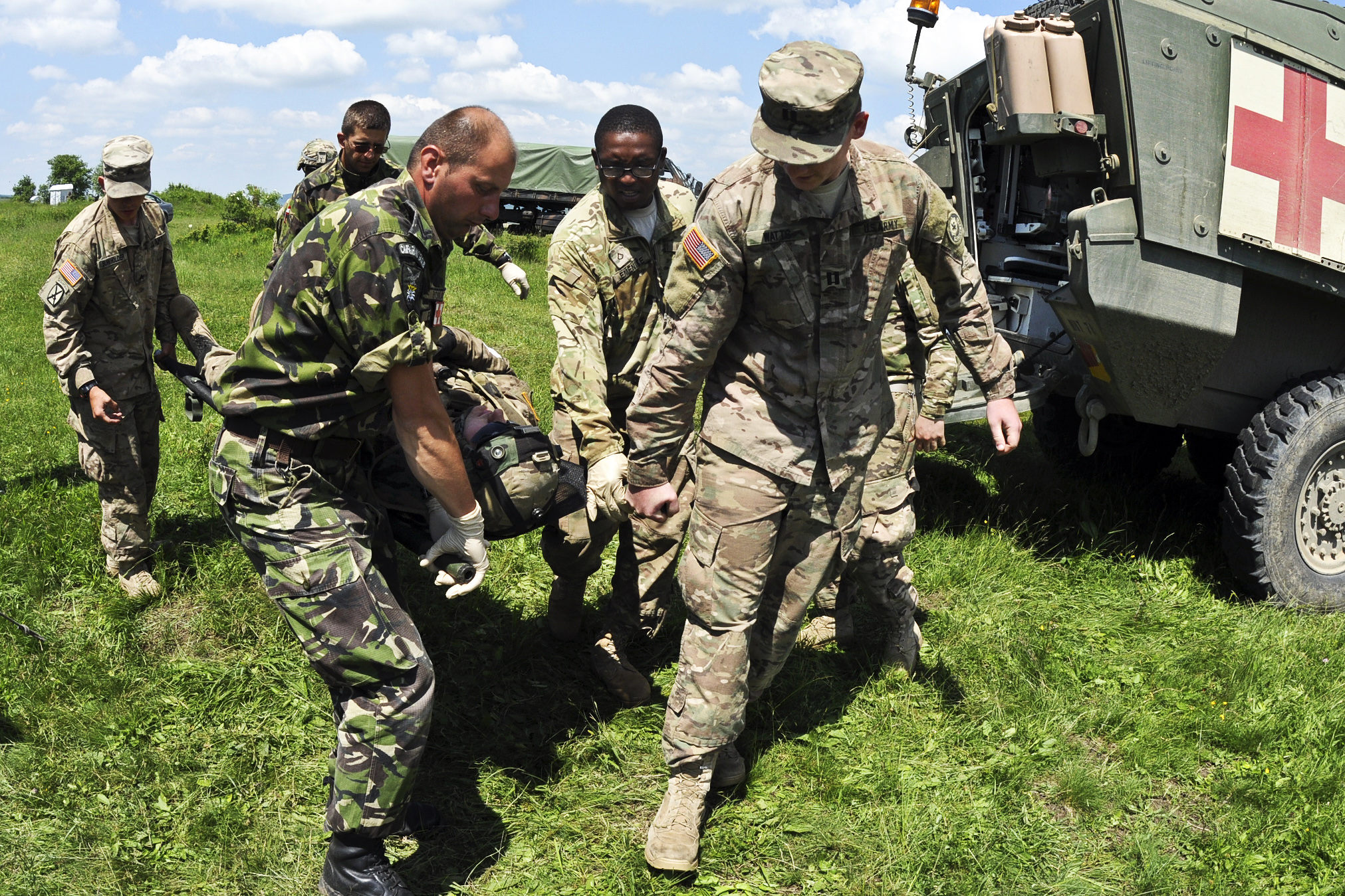 U S Army Capt Nathaniel Watts Right Helps Combat Medics As They Free