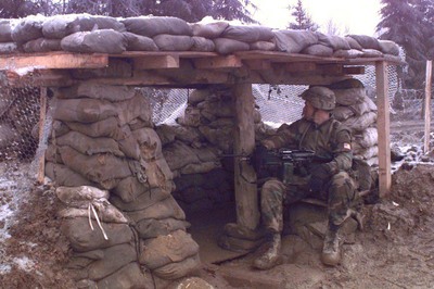 U.S. Army soldier provides security on gate at Tuzla Air Base, Bosnia ...
