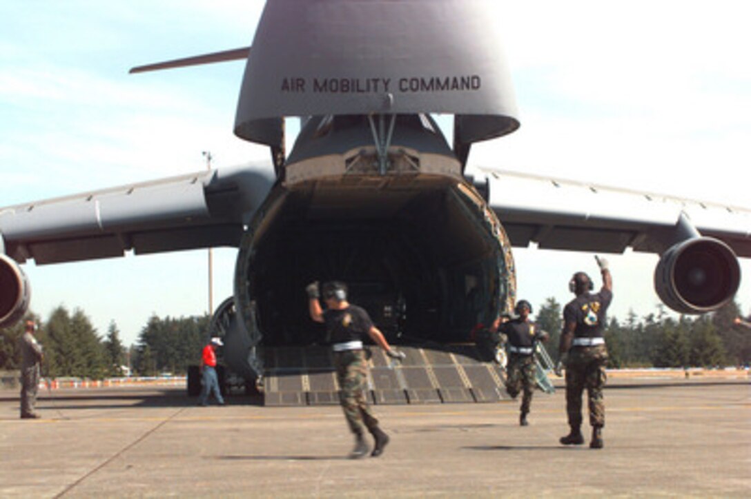 Team members from the 349th Air Mobility Wing run to complete the ...