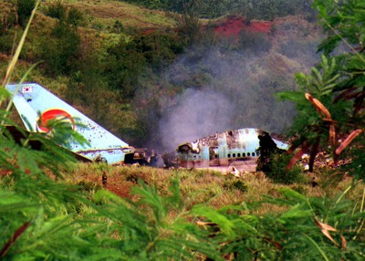 U.S. Air Force firefighters and Guam Police Department rescuers survey ...