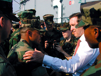 Marines of the 26th Marine Expeditionary Unit crowd around Secretary ...