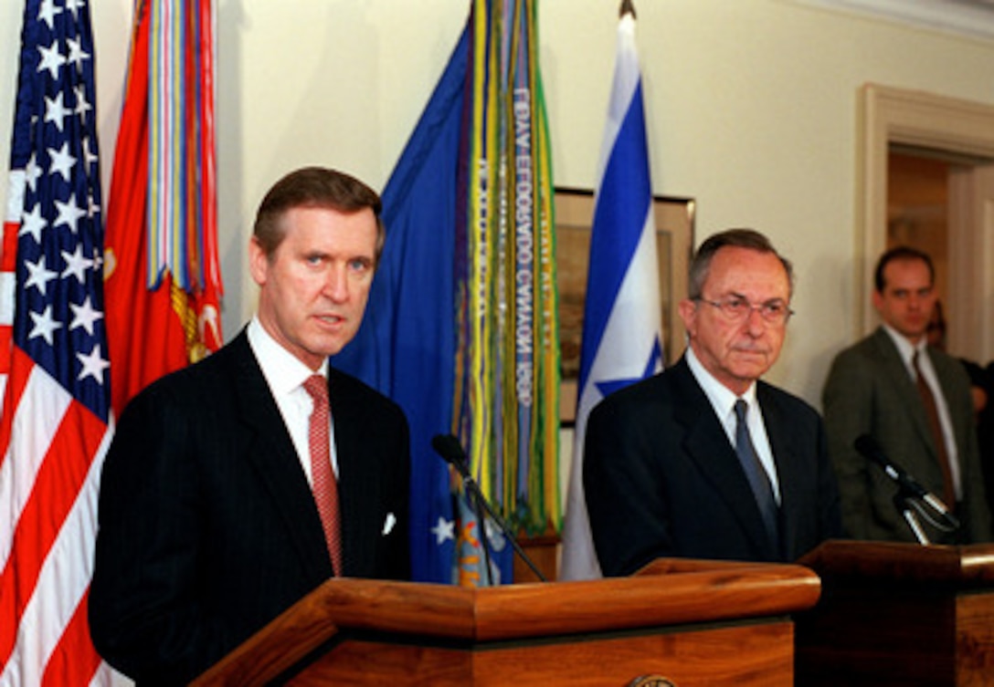 Secretary Cohen answers a question during a joint press conference with ...