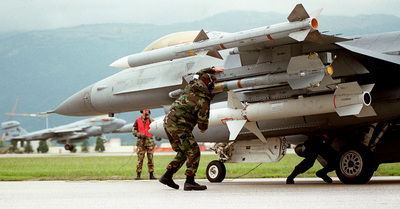 A crew chief from the 78th Fighter Squadron makes a final inspection of ...