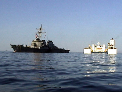 The USS Cole waits for the heavy transport ship M/V Blue Marlin to ...