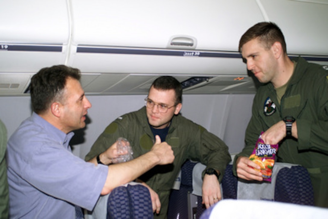 Lts. Patrick Honeck and Richard Payne listen to Navy Cmdr. Benard ...