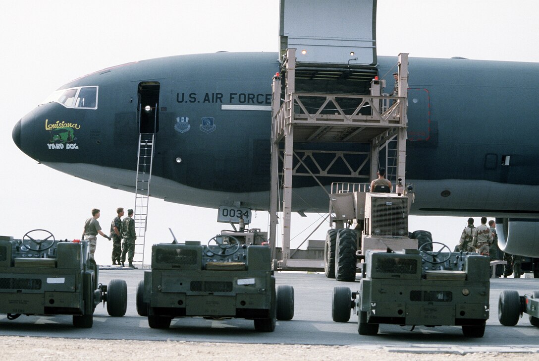 Bomb lifts are loaded aboard a KC-10A