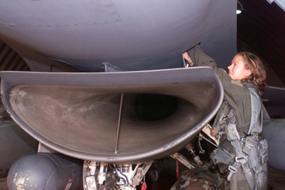 Air Force 1st Lt. Julie Moore retrieves her weapon system videotapes ...