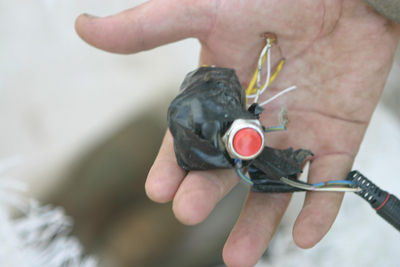 A trigger for an improvised explosive device is disarmed and displayed.