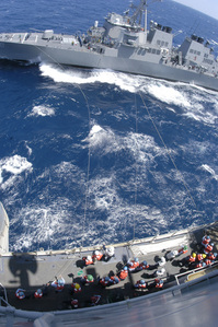 Crewmembers aboard the USS Bataan (LHD 5) and the USS Laboon (DDG 58 ...
