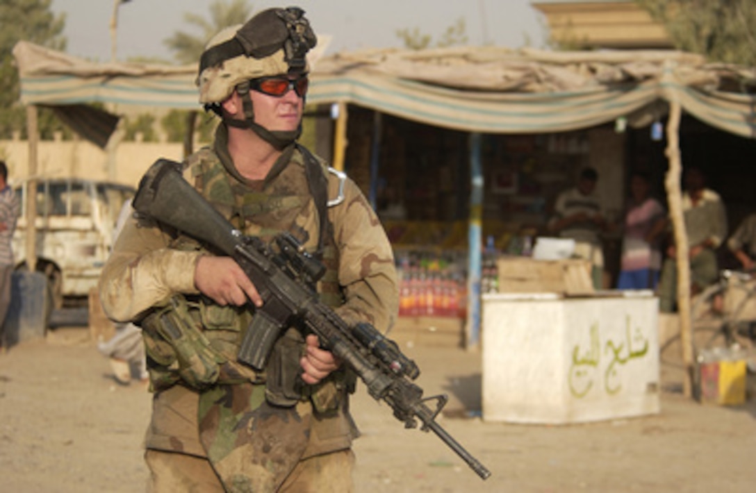 U.S. Army Spc. Daniel Firszt secures an area during a routine patrol.