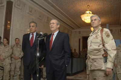 U.S. Ambassador to Iraq Zalmay Khalizad and Gen. George Casey Jr. flank ...