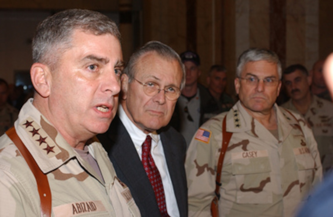 Gen. John Abizaid answers a reporter's question during a media ...