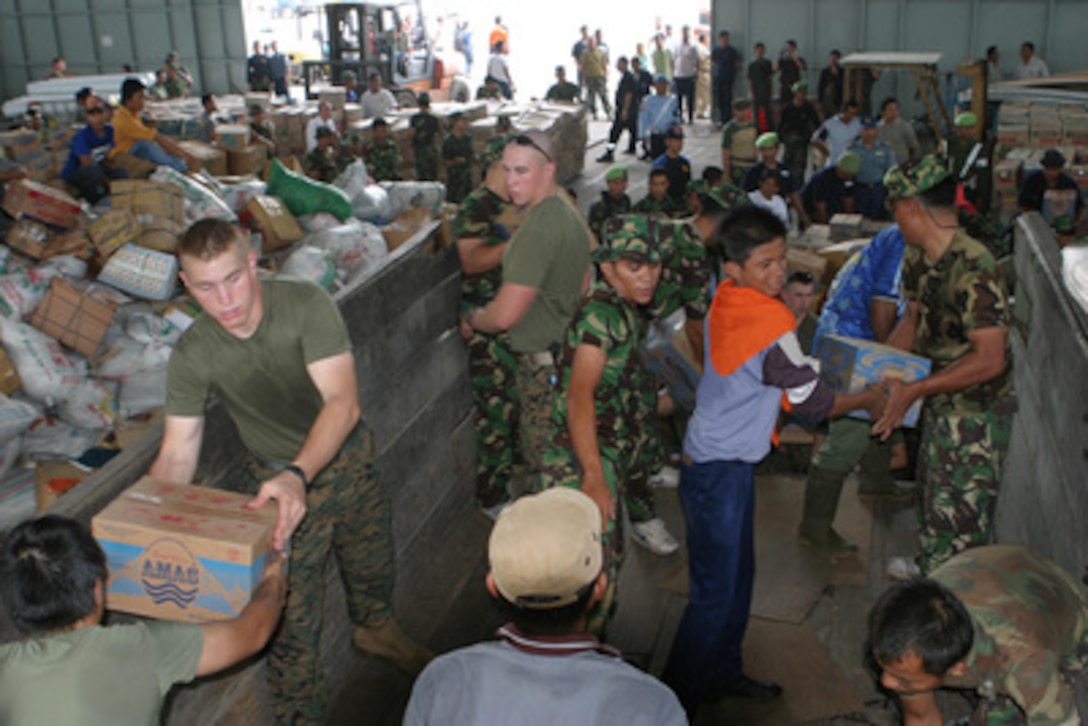 U.S. Marines help distribute humanitarian aid.