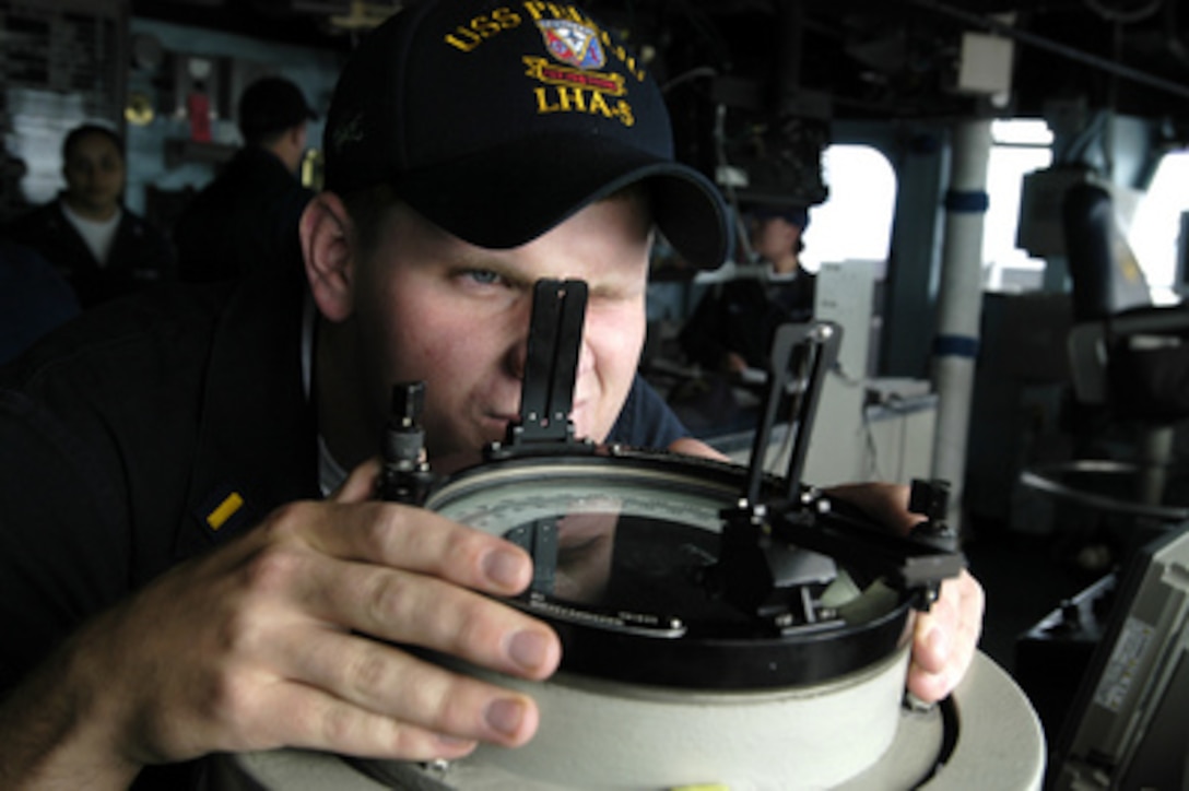 Navy Ensign Daniel Sullivan takes a bearing of a surface contact. | U.S ...