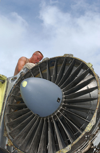 Air Force Staff Sgt. Benjamin Davis removes a nose cowl of an engine on ...