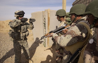 Army Staff Sgt. Jason Lyday instructs Iraqi Army soldiers on muzzle ...