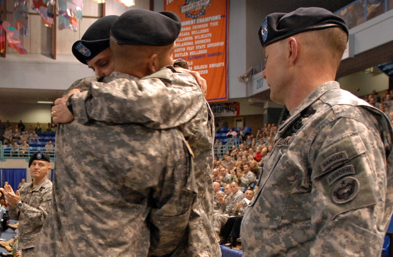 U.S. Army Col. Burdett K. Thompson, center, congratulates U.S. Army Col ...