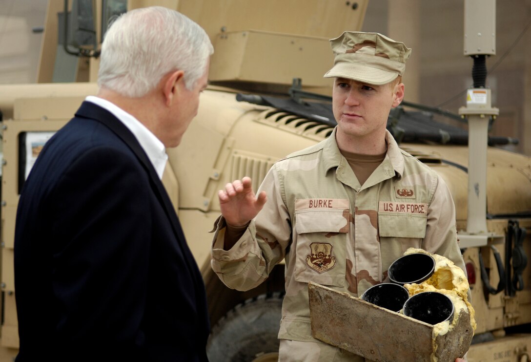 Defense Secretary Robert Gates speaks with U.S. Air Force Staff Sgt ...