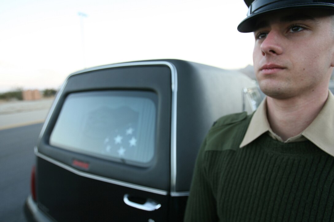 U.S. Marine Lance Cpl. Michael J. Allen, an honor guard member with 2nd ...