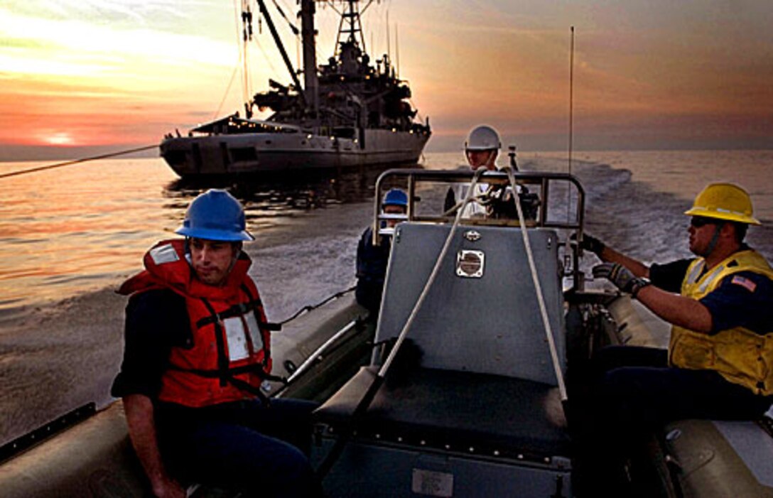 From left, U.S. Navy Boatswain's Mate 2nd Class Joshua Margolin ...