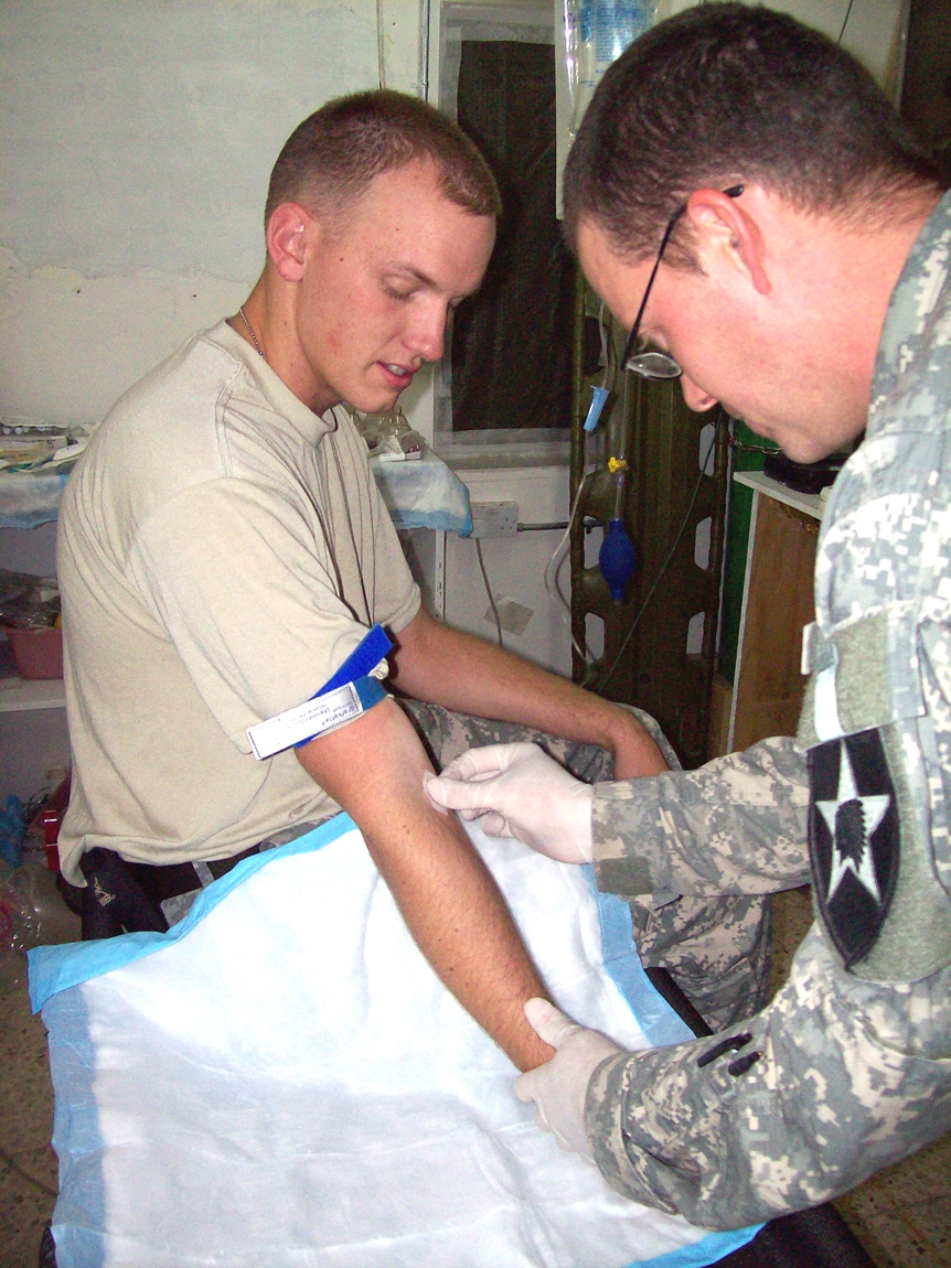 Army Pfc. Chris Llewellyn, a medic with the 2nd Battalion, 17th Field ...
