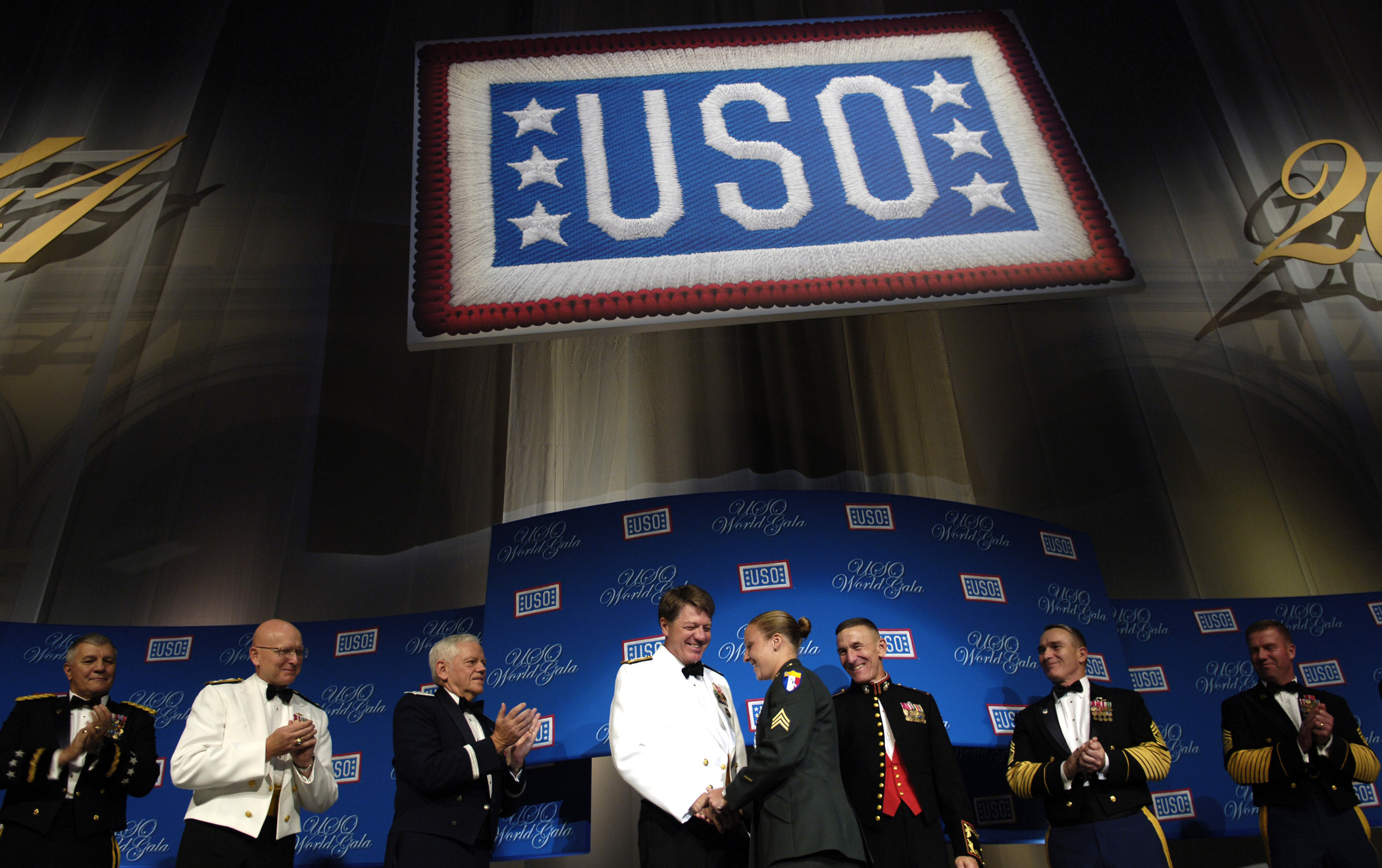 Army Sgt. Leigh Hester is congratulated by numerous senior defense ...