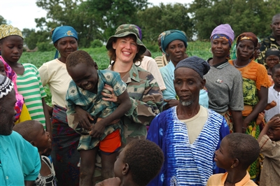 Maj. Lynn Shinabery shares a laugh with villagers in Tampiong, Ghana.