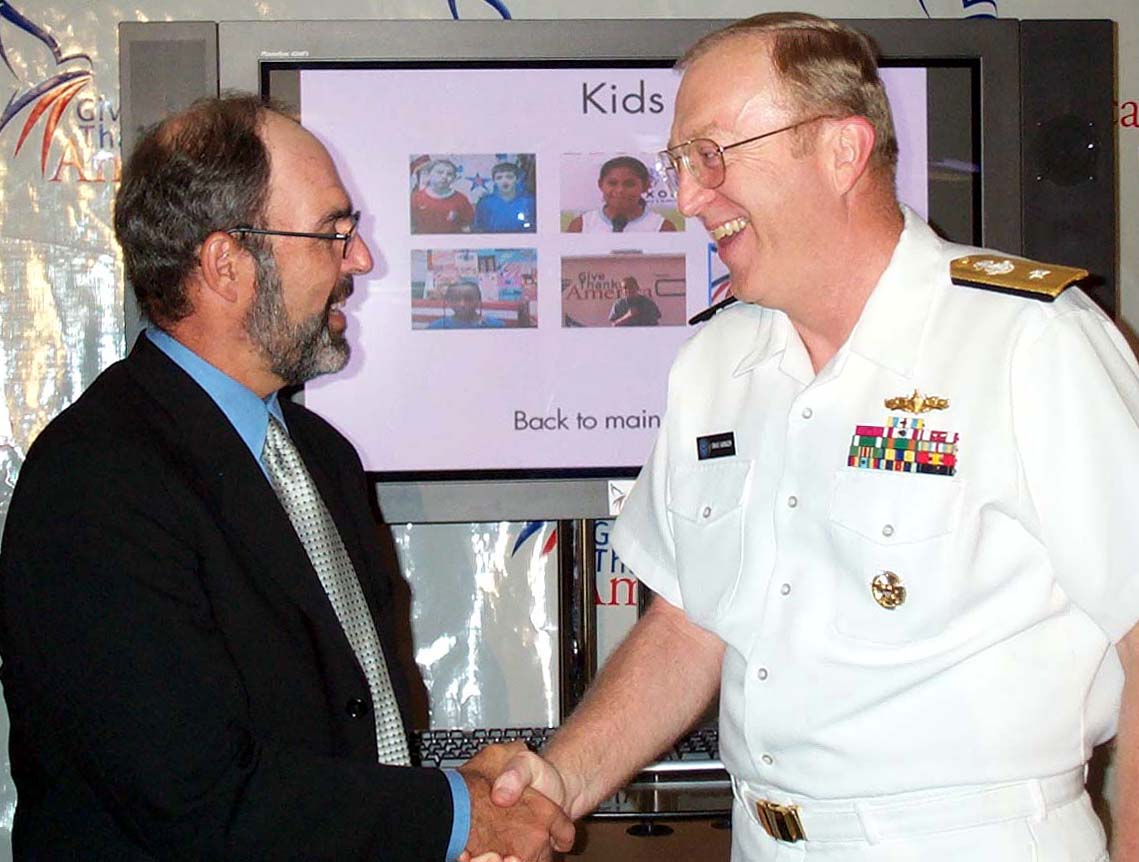 Hewlett-Packard President Michael Capellas (left) and Navy Rear Adm ...