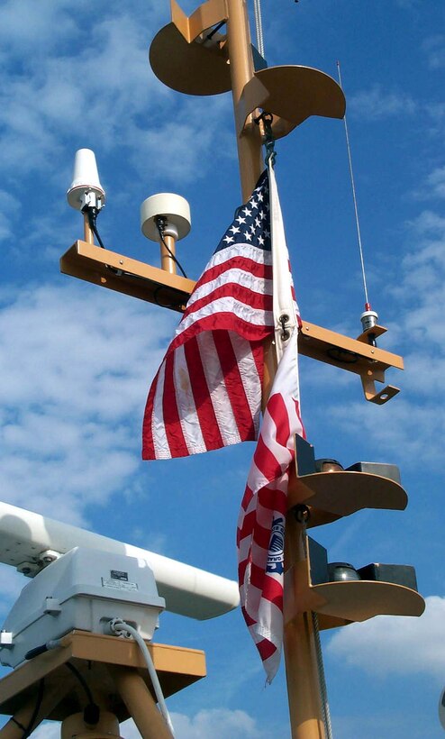 Radar unit sits near the top of the patrol boat's mast, along with ...