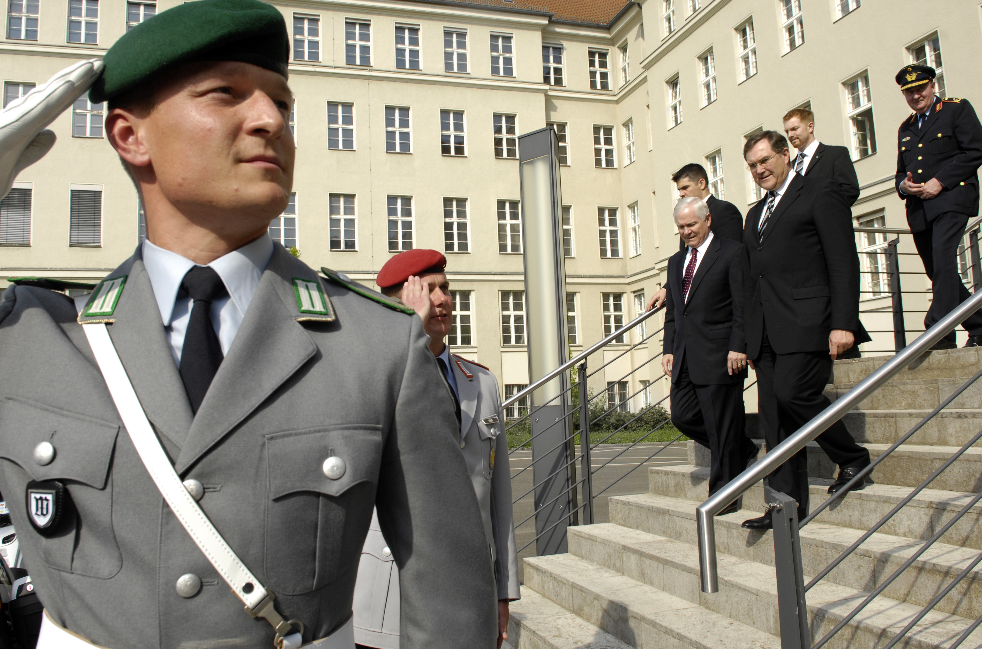 German military members salute as U.S. Defense Secretary Robert M ...