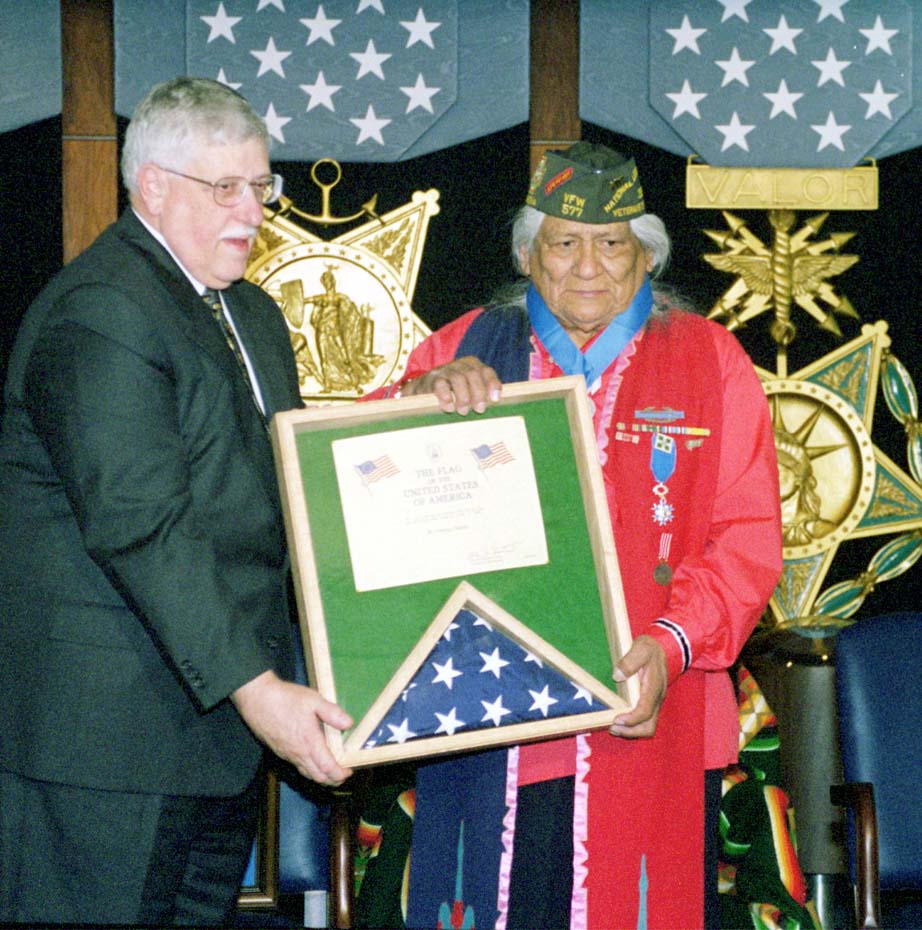 Arthur L. Money presents Charles Chibitty with a cased American flag ...