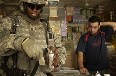 Staff Sgt. Frank Woode looks for a positive identification of ...