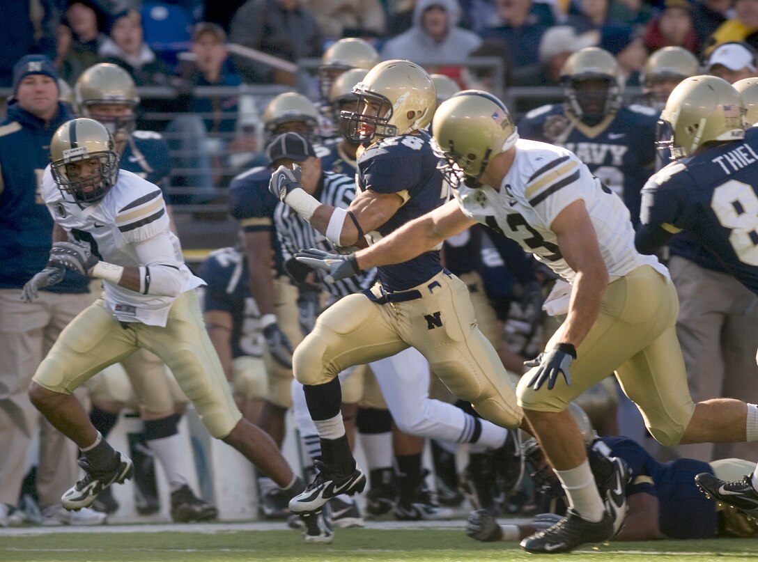 U.S. Naval Academy senior slot back Zerbin Singleton pulls away for a touchdown during the ...