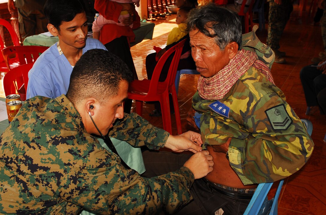 U.S. Navy Lt. Javier Agraz, assigned to the USS Essex, uses a ...