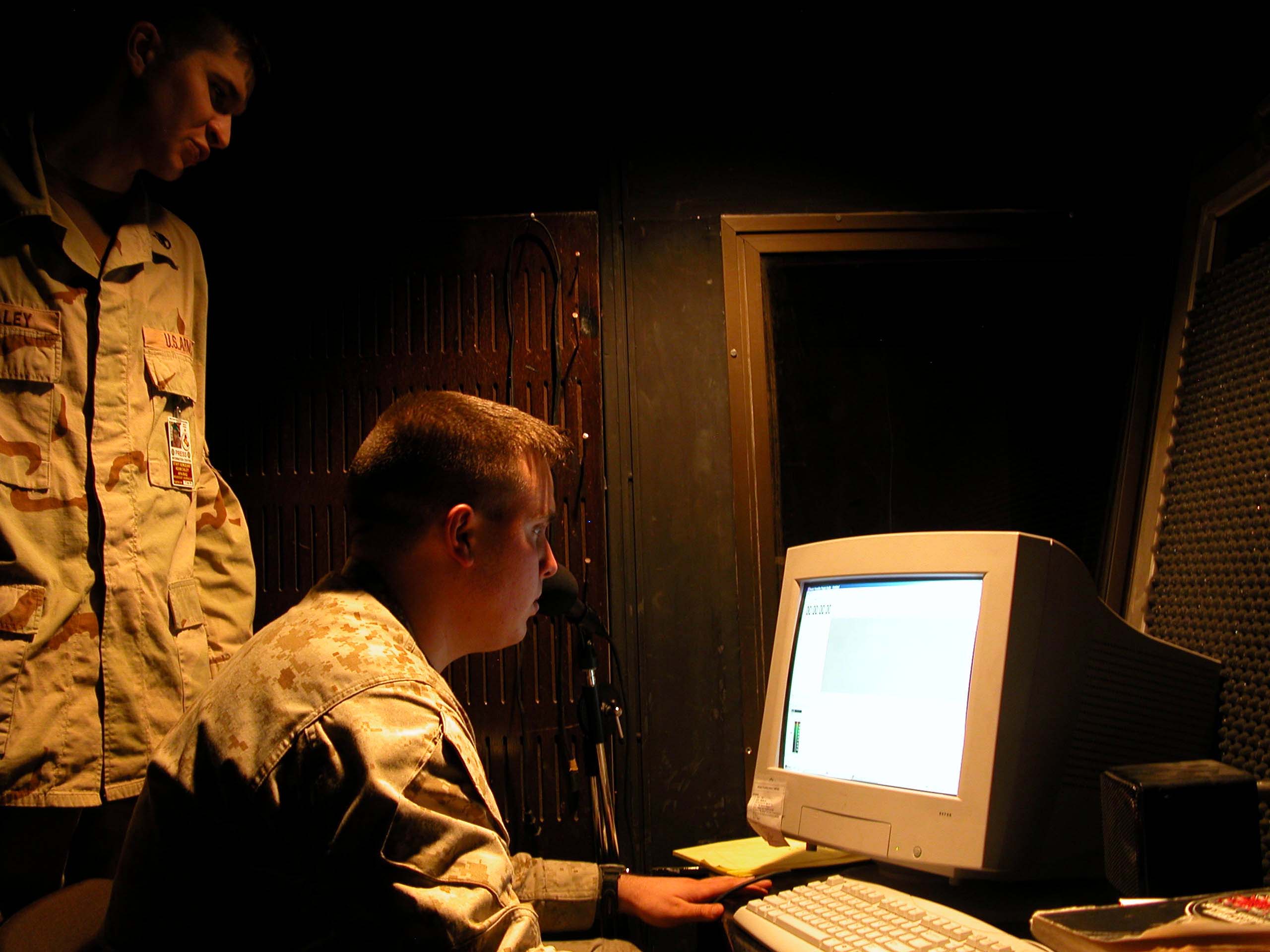 Army Staff Sgt. Adam Daley, left, and Marine Cpl. Isaac Pacheco work on ...