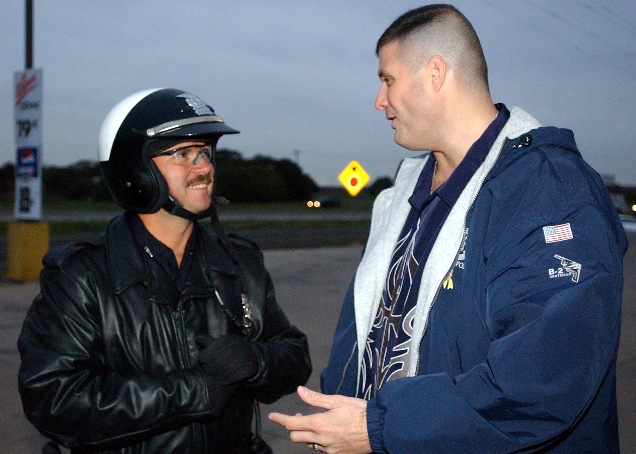 Air Force Tech. Sgt. Daniel Vargas speaks to Motor Officer Patrick ...