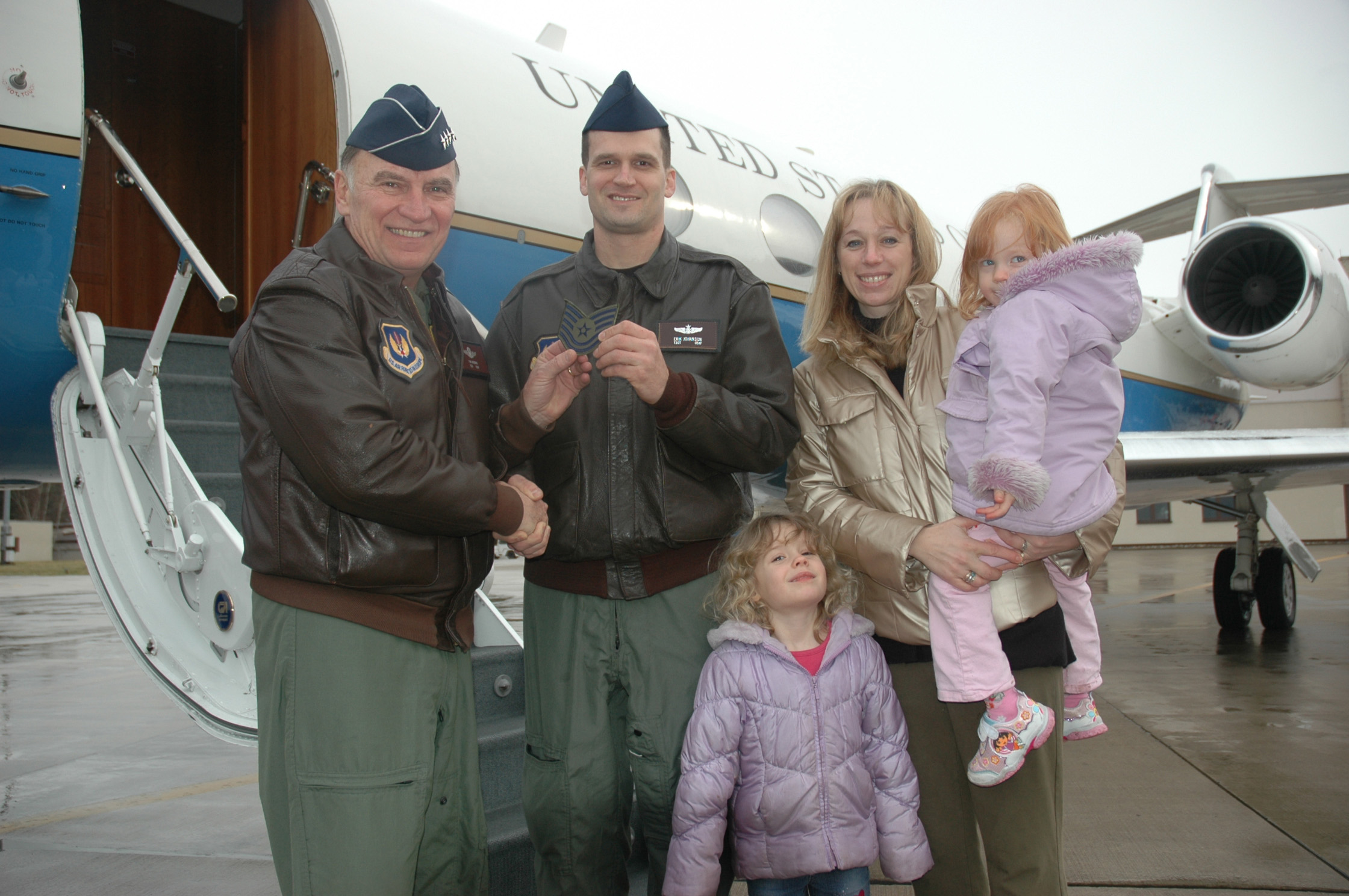 Gen. Tom Hobbins presents STEP promotion to Tech. Sgt. Erik Johanson