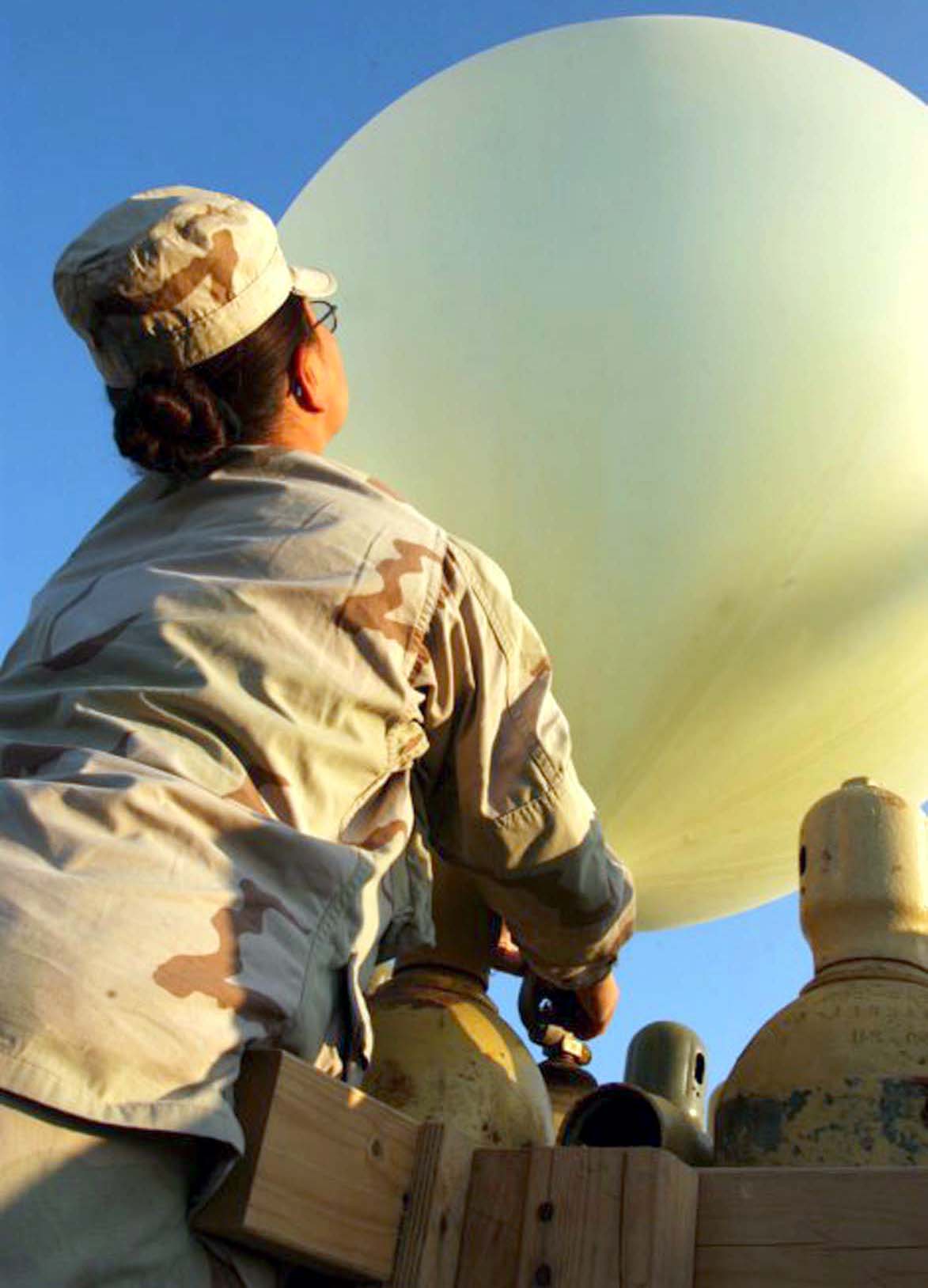 Spc. Kate Waters, a meteorological team crewmember assigned to the 1st ...