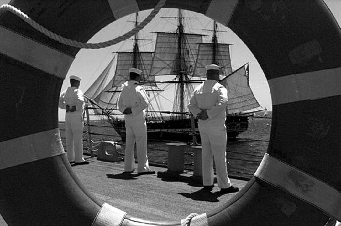 USS Constitution, framed by a life ring aboard the U.S. Navy destroyer ...
