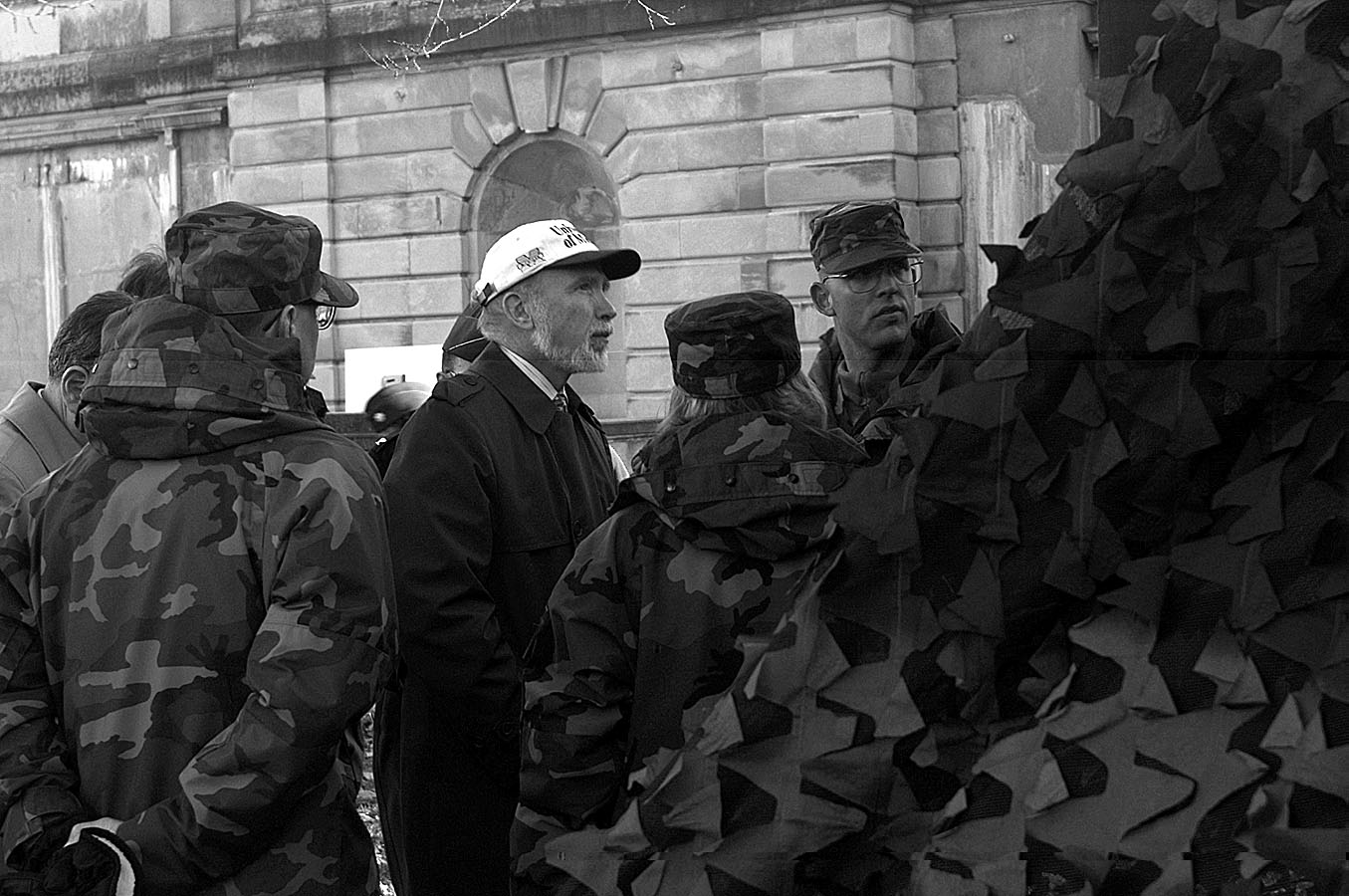 Army Staff Sgt. Robert L. Davis (right) explains the M- 31E1 Biological ...
