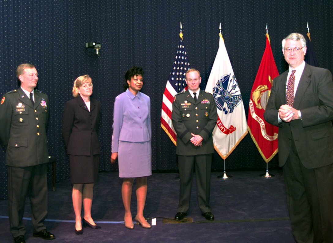 Deputy Defense Secretary John Hamre, right, introduces the major ...