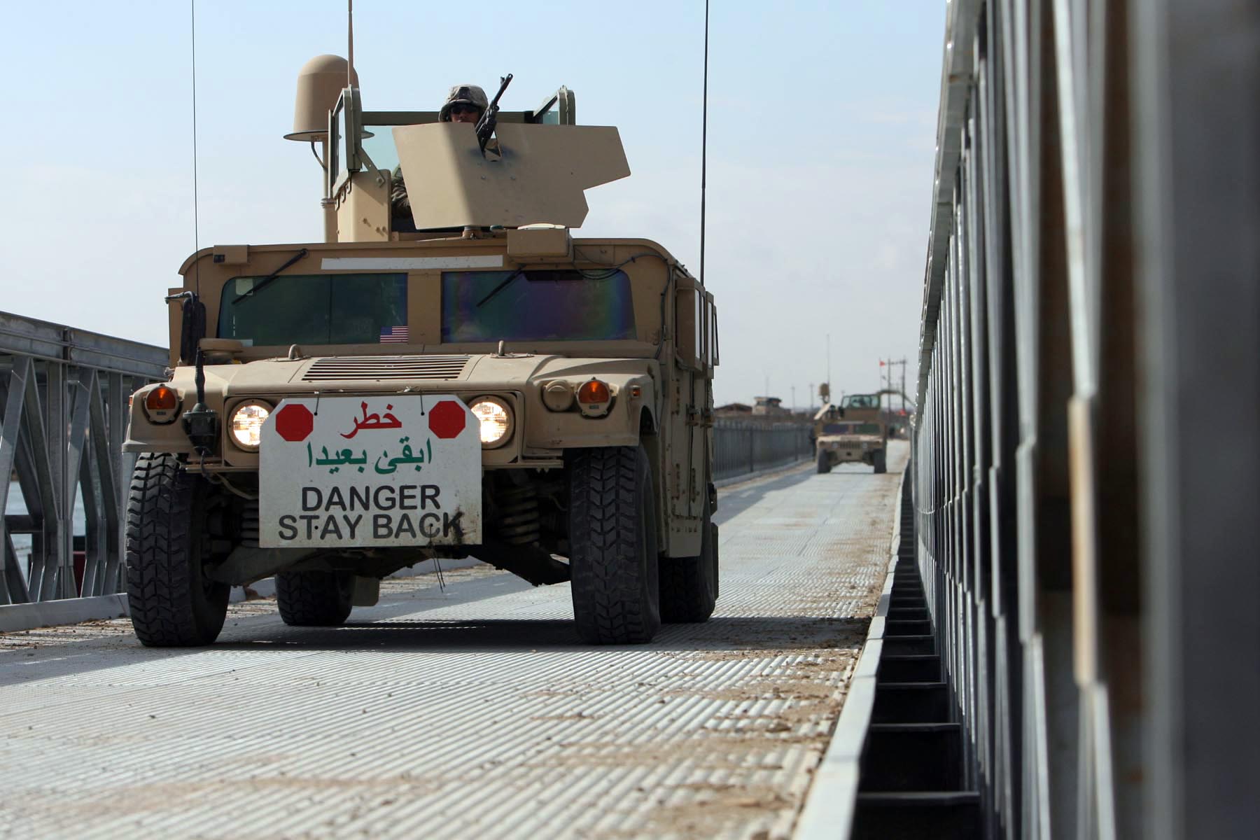 A U.S. Marine battalion-level convoy security team with 3rd Battalion ...