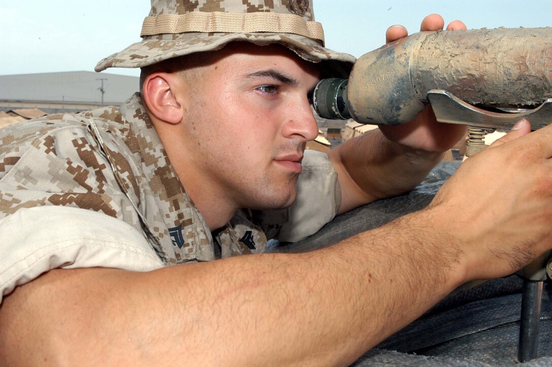 Marine Cpl. Jacob Wells, a sniper attached to Task Force Rawhide, scans ...