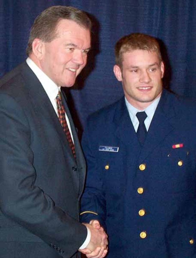 Homeland Security Department Secretary Tom Ridge shakes hands with ...