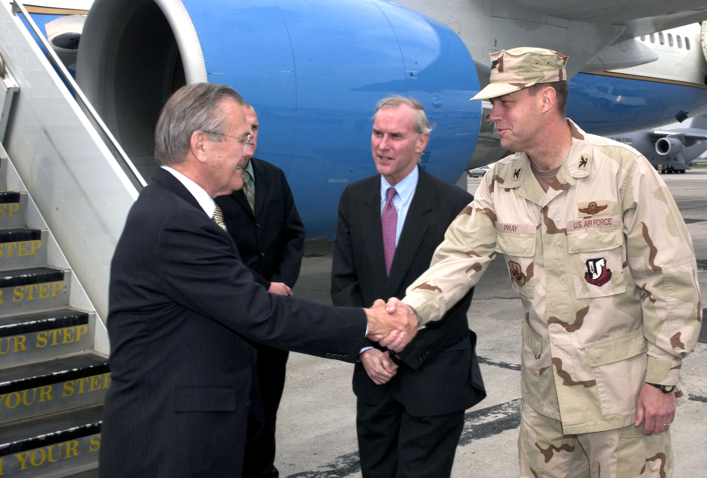 Defense Secretary Donald H. Rumsfeld is greeted by Manas Air Base ...