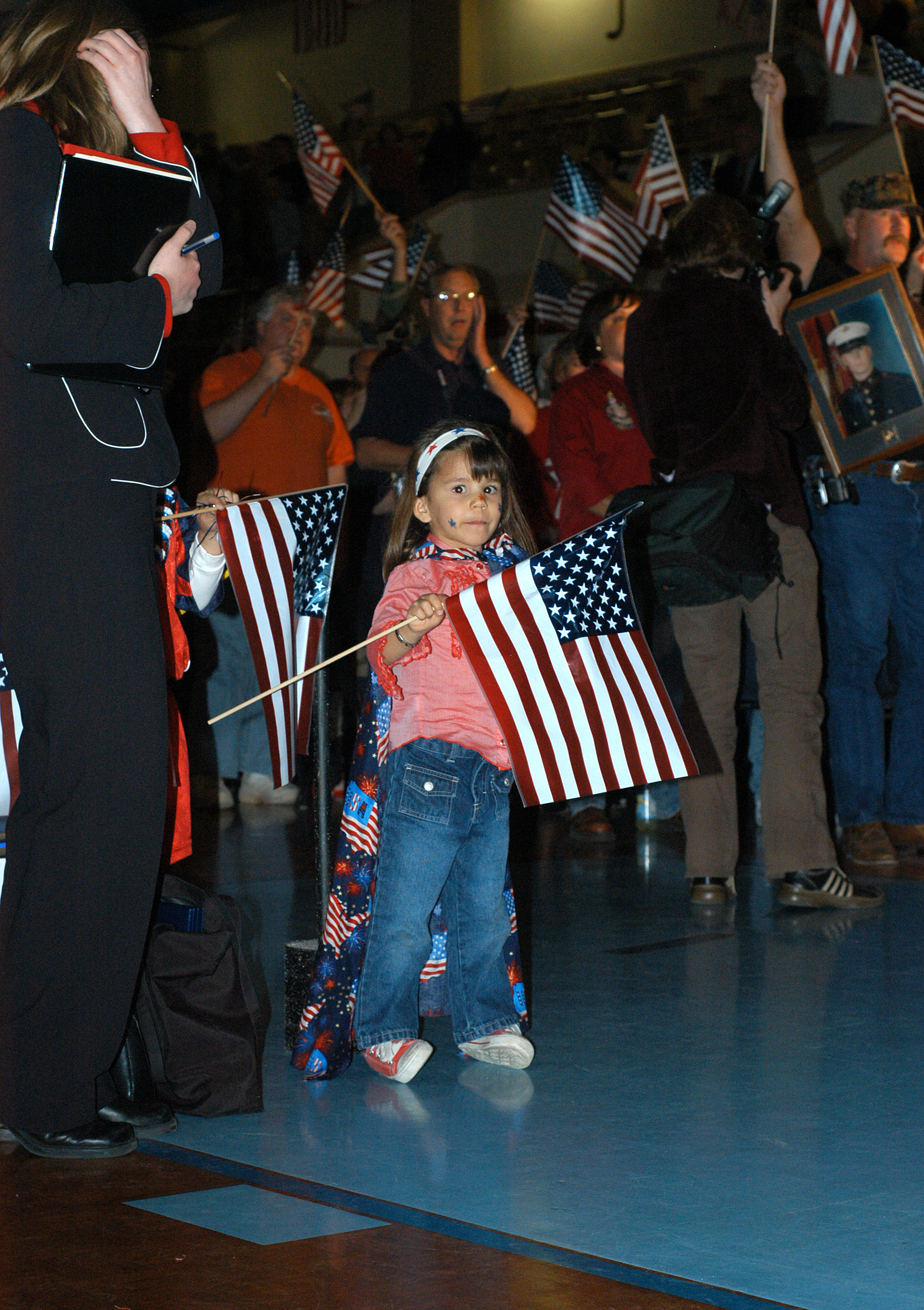 Ivy Allen, 4, shows her support by sporting red, white and blue face ...