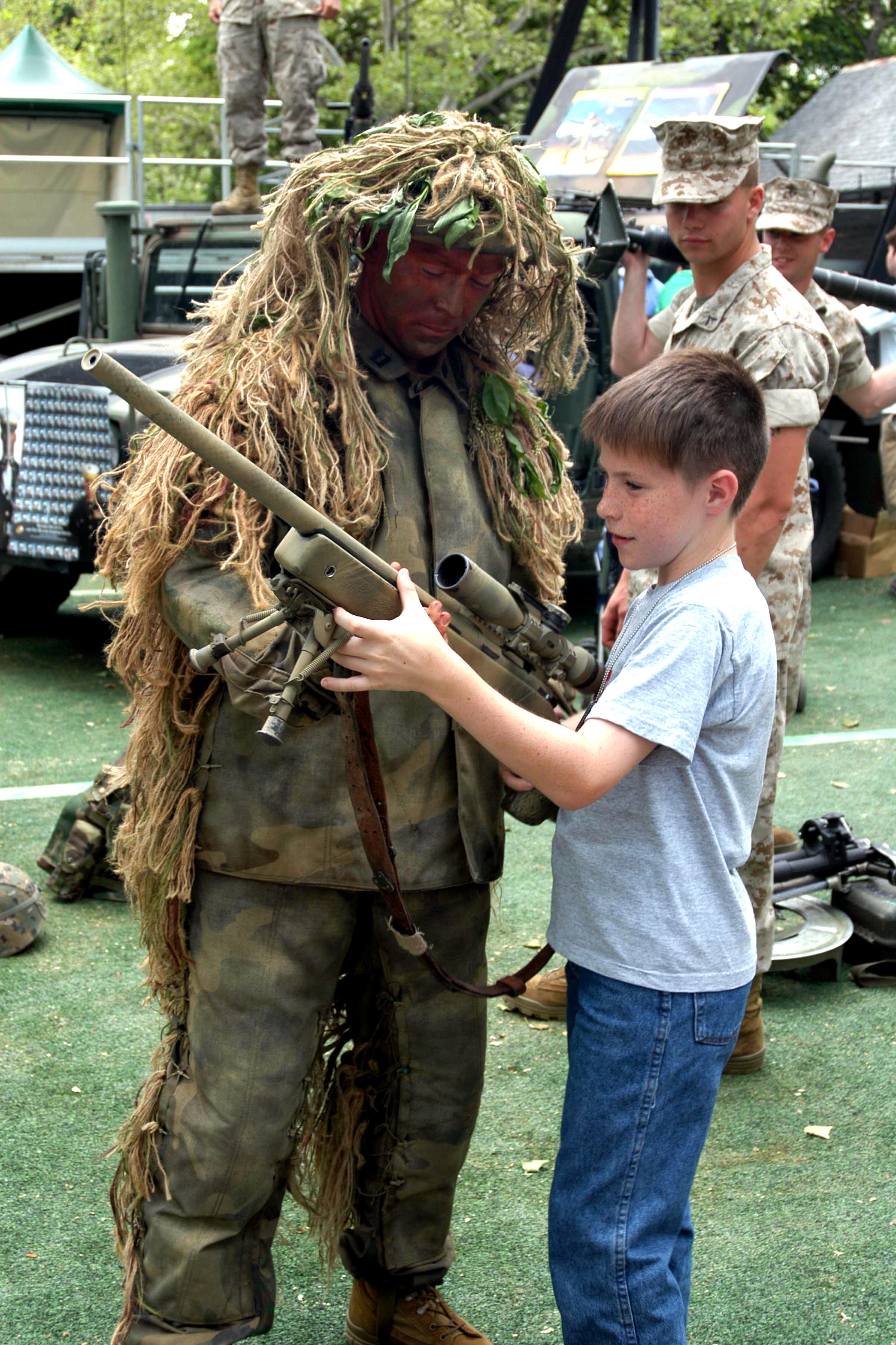 Marine Capt. Michael Pretus lets fourth-grader Shayne Narro check out ...