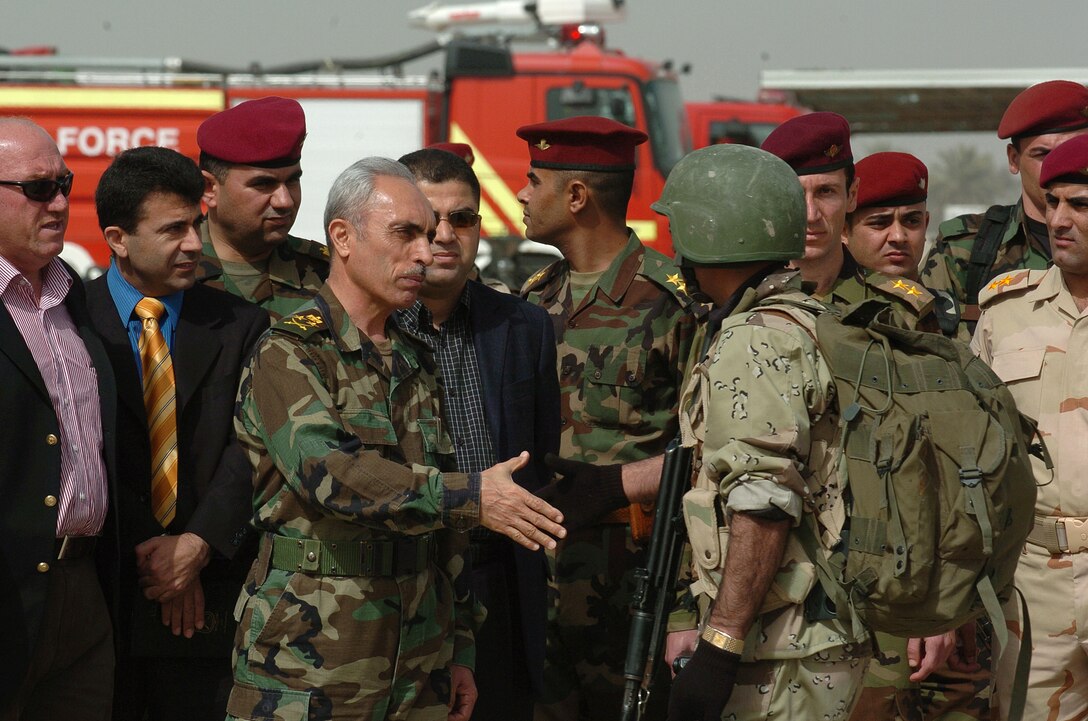Gen. Babakir Zebari, chief Joint Forces Iraq, shakes the hand of a 2nd ...