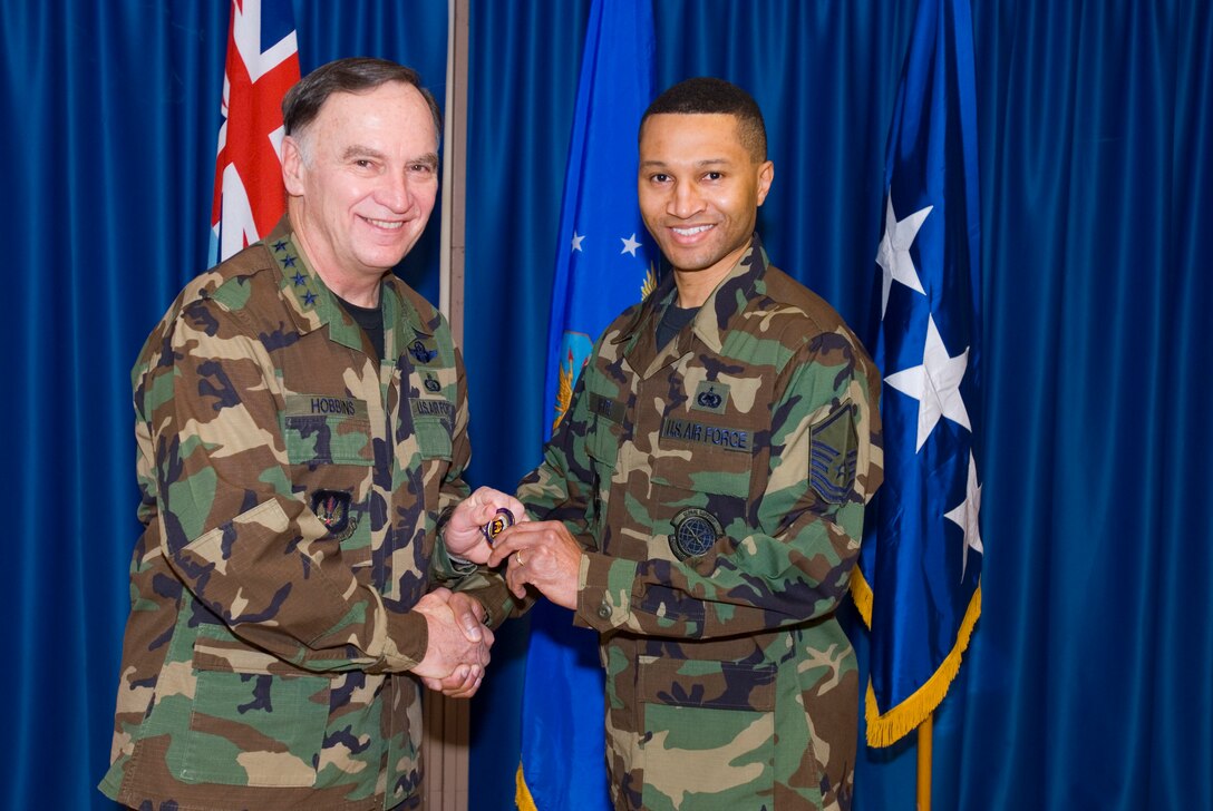 Gen. Hobbins presents coin to MSgt Darrin White