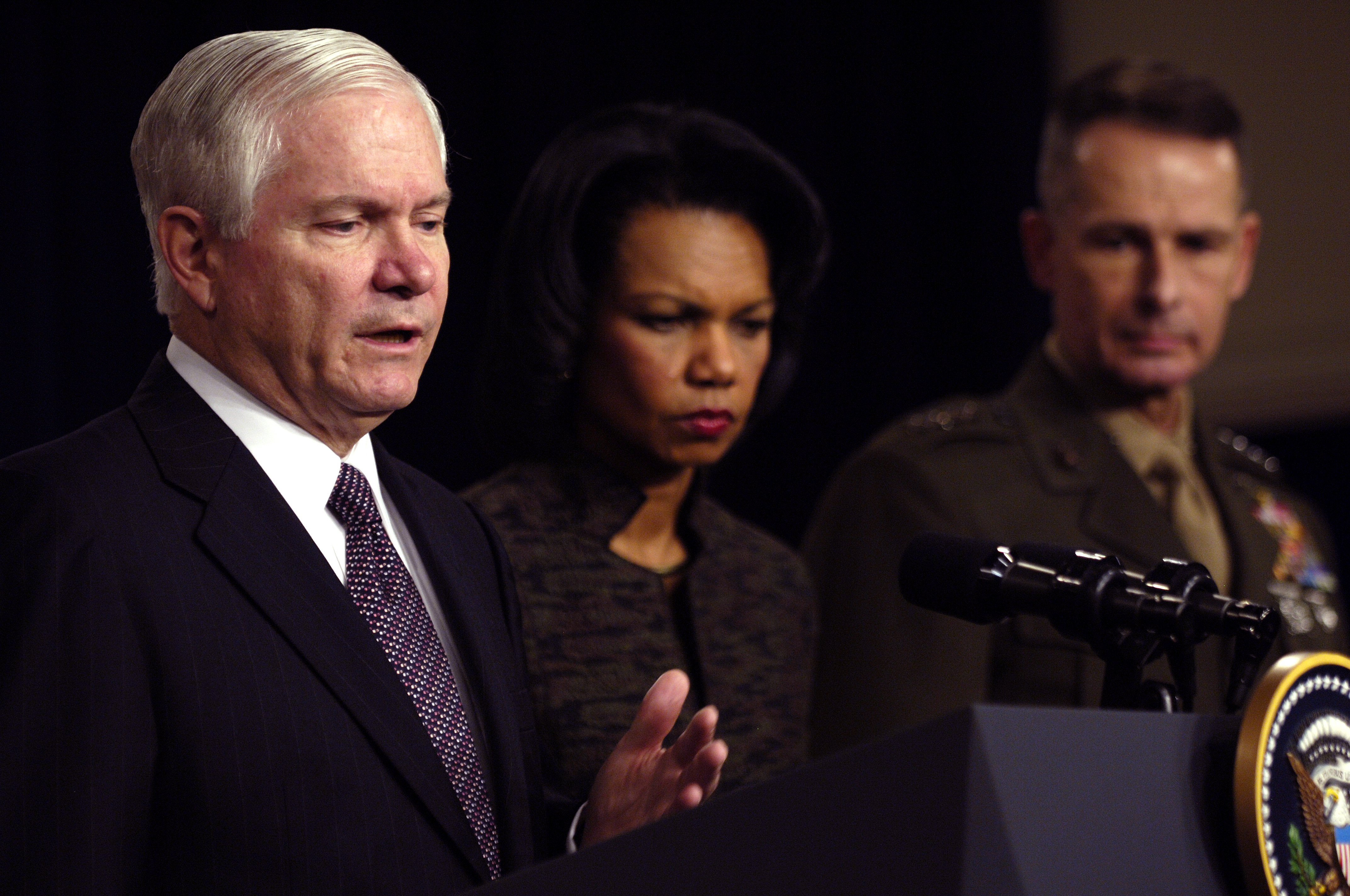 Defense Secretary Robert Gates, left, accompanied by Secretary of State ...